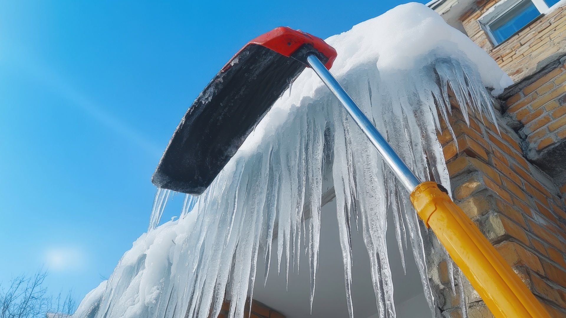 How Snow, Ice, and Roof Raking Stress Your Home